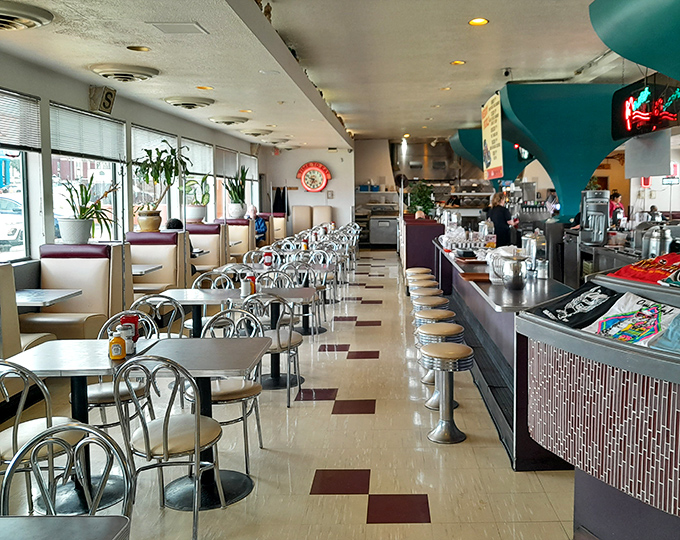 Classic diner perfection with chrome, checkerboard floors, and counter seating that practically begs you to spin on the stools.