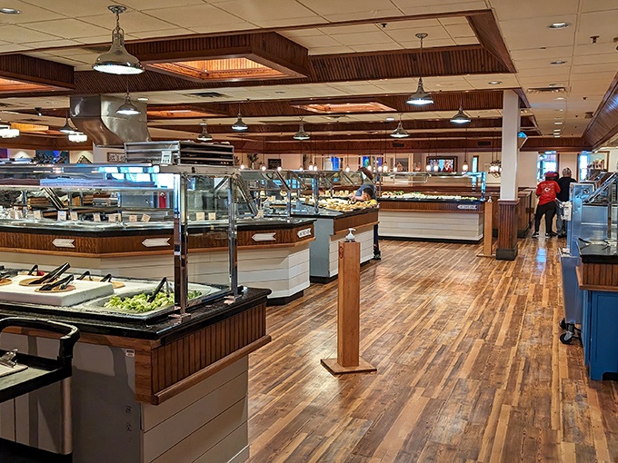 Polished wood floors and well-organized serving stations create an inviting atmosphere where the serious business of buffet navigation becomes a delightful adventure.