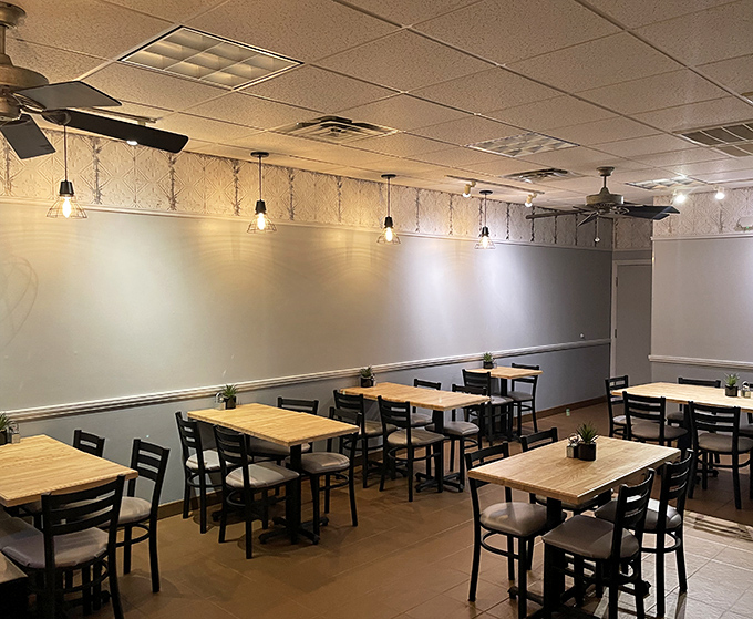 Clean lines, simple tables, and zero pretension. This dining room isn't trying to impress you with decor because it's saving all the wow-factor for your plate.
