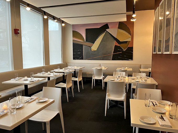 Clean lines and modern elegance define the dining room, where contemporary art and neutral tones create the perfect backdrop for food that deserves your full attention.