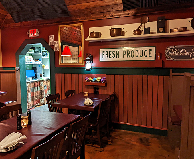 Wooden paneling meets vintage cookware in this cozy dining room where the "Fresh Produce" sign isn't just decoration&mdash;it's a delicious promise kept.