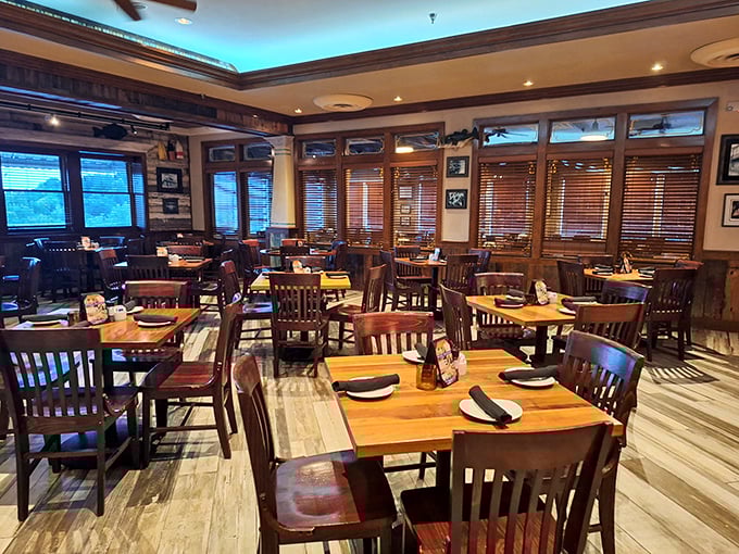Warm wood tones, comfortable seating, and that subtle blue accent lighting create the perfect backdrop for seafood indulgence without the ocean view.