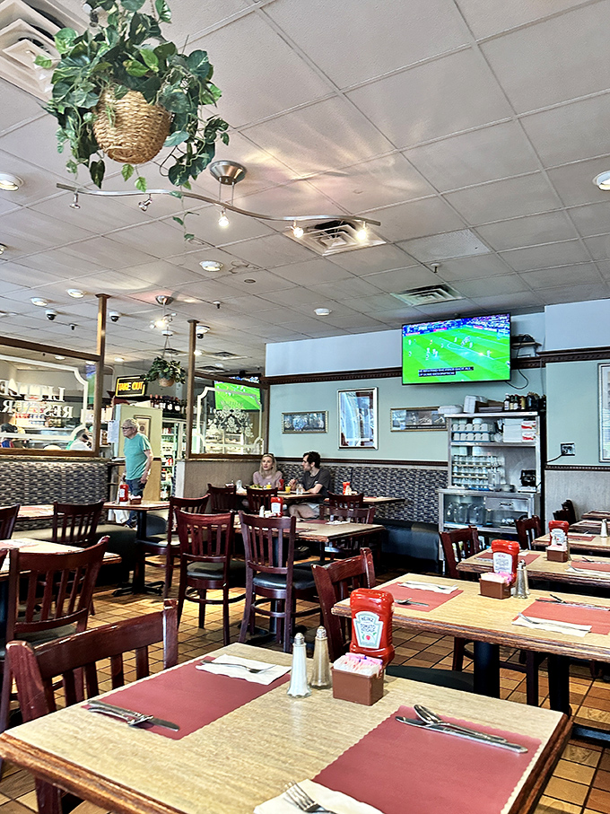 Inside, hanging plants soften the classic diner aesthetic while TVs broadcast the game &ndash; that perfect blend of homey and happening.