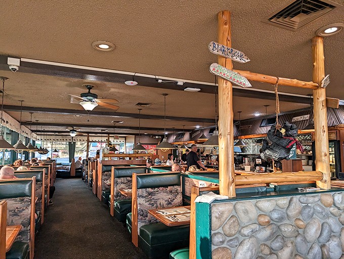 Rustic log beams and cozy booths create that perfect "mountain lodge meets family restaurant" vibe where calories don't count and conversations flow freely.