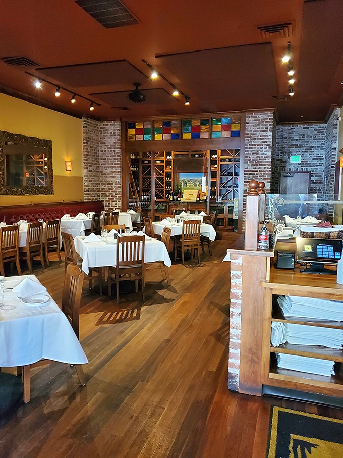 White tablecloths, exposed brick, and that stunning stained glass&mdash;this dining room isn't just setting the stage for dinner, it's making a solemn vow to your taste buds.