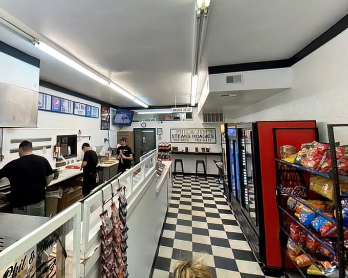 Where sandwich magic happens. The black and white checkered floor isn't trying to impress anyone, but the aroma wafting through this space certainly will.