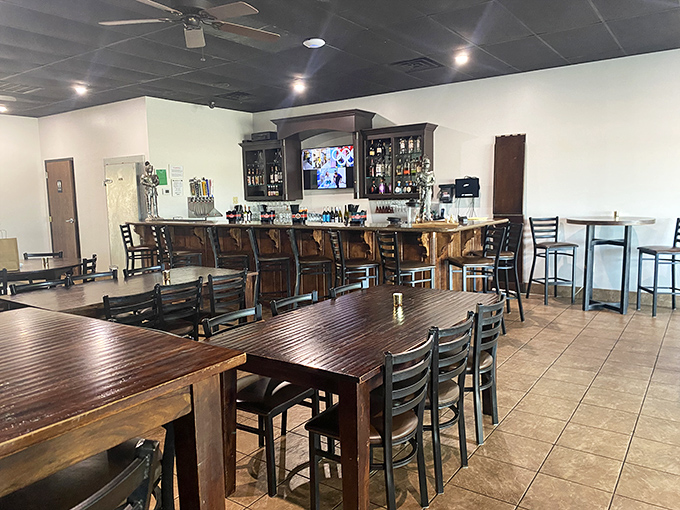 Inside, warm wooden tables and a welcoming bar create the perfect backdrop for culinary exploration. Comfort meets sophistication in this thoughtfully designed space.