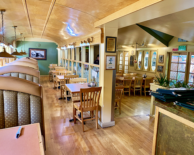 The historic trolley car interior combines nostalgia with comfort. Those wooden booths have witnessed countless Utah family celebrations and first dates.