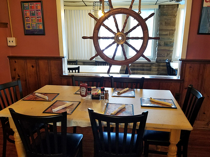 Ship's wheels and wooden accents aren't just decor here – they're a promise that your meal sailed in from nearby waters rather than distant freezers.