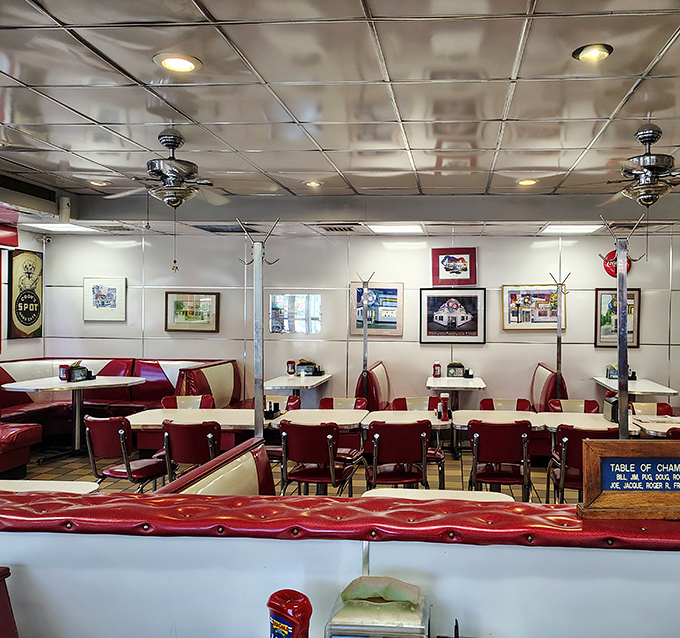 Red vinyl booths that have cradled generations of hungry patrons, where every seat feels like the best one in the house.
