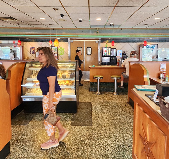 Classic diner charm with a dessert case that whispers sweet nothings to your willpower. The terrazzo floors have witnessed decades of satisfied diners coming back for more.