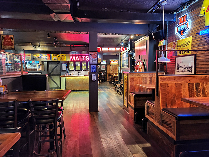 Step inside and the warm wooden interior whispers, "Stay awhile." Neon signs cast a glow that makes everyone look like they've made the right decision.