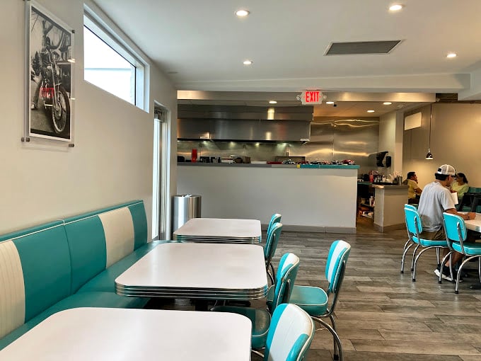 Retro meets modern in this diner-inspired interior where turquoise and white booths invite you to slide in and stay awhile.