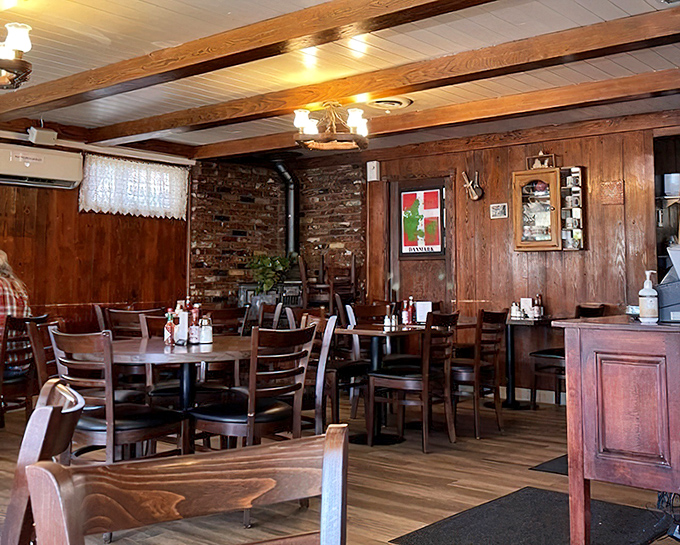 Exposed brick meets warm wood paneling in this cozy interior. Like stepping into your Danish grandmother's dining room, if you had a Danish grandmother.