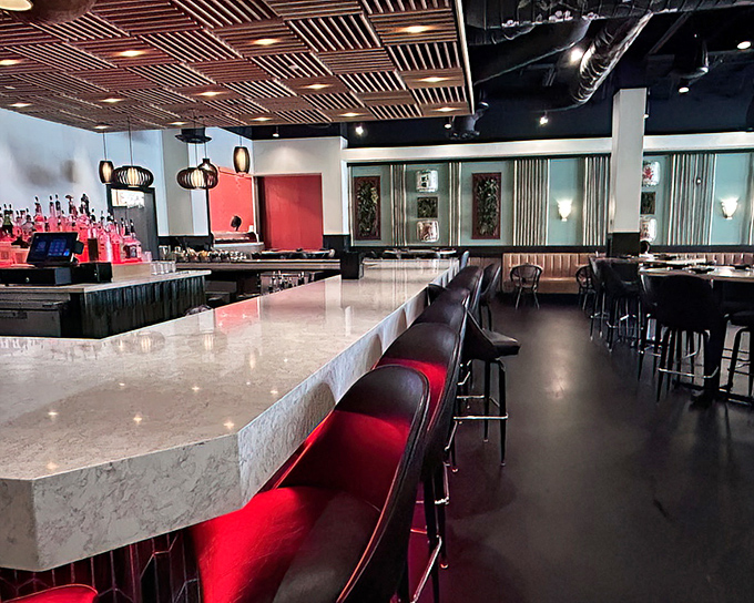Red accents and wooden lattice ceilings create a dining atmosphere that's both sophisticated and inviting&mdash;like a stylish friend's apartment you never want to leave.