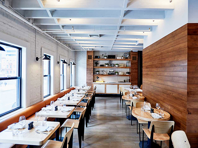 Sleek wooden walls and natural light transform this diner into something unexpected—comfort food in its Sunday best.