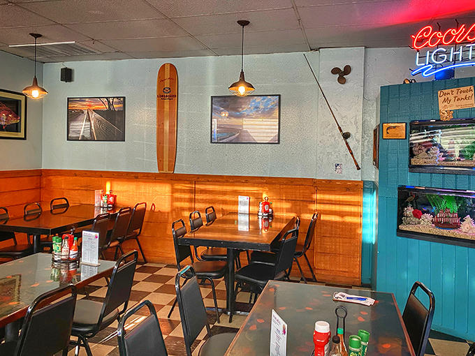 Classic beach restaurant vibes with surfboards, neon signs, and that checkered floor that's seen countless happy diners.