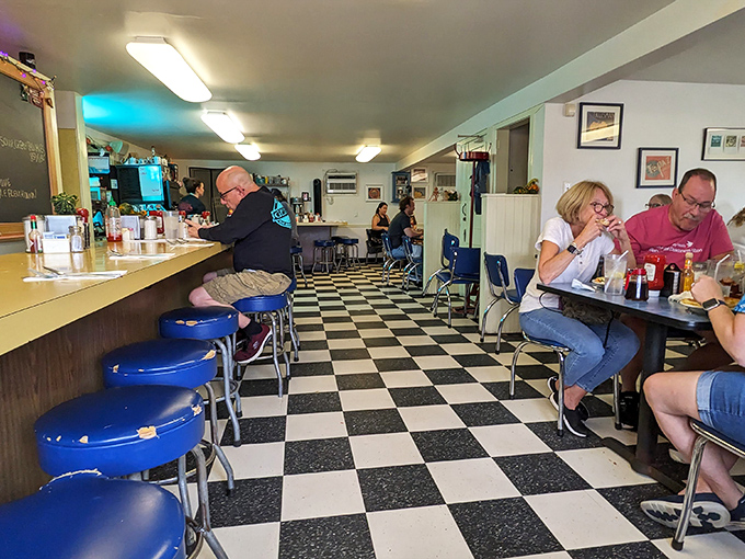 The classic black and white checkered floor isn't just nostalgic&mdash;it's practically the universal signal for "good food happens here."