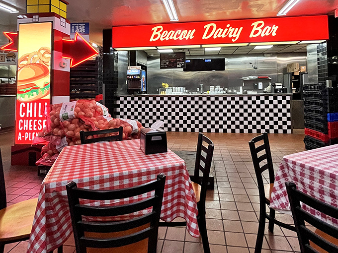 Classic red-checkered tablecloths and the nostalgic "Beacon Dairy Bar" sign transport you to a time when diners were the original social networks.