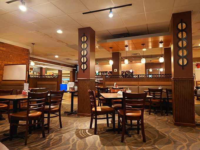 Warm wood paneling, comfortable seating, and thoughtful lighting create that perfect "where everybody knows your name" atmosphere that keeps regulars coming back.