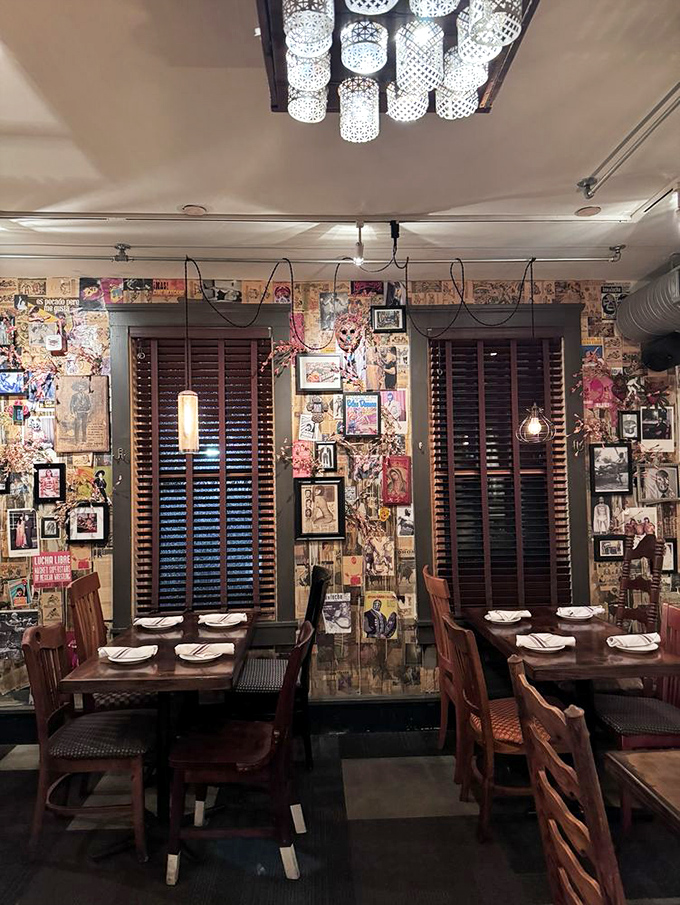 Collage-covered walls tell visual stories while pendant lights cast a warm glow&mdash;dining room d&eacute;cor that's equal parts art gallery and cozy cantina.