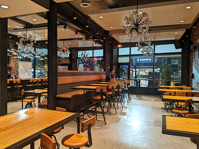 Industrial-chic meets comfort in Landmark's dining room, where those starburst chandeliers aren't the only things that'll make your eyes light up.