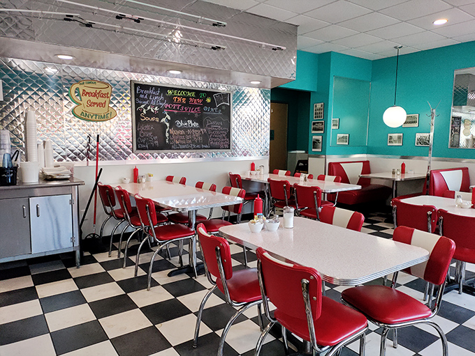 Classic Americana in every corner—turquoise walls, red vinyl booths, and checkered floors create the diner trifecta that whispers, "Your diet starts tomorrow."