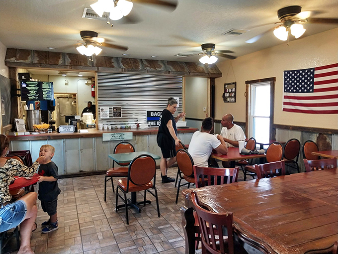 The kind of honest interior where ceiling fans work overtime and nobody's pretending this is anything but serious barbecue territory.