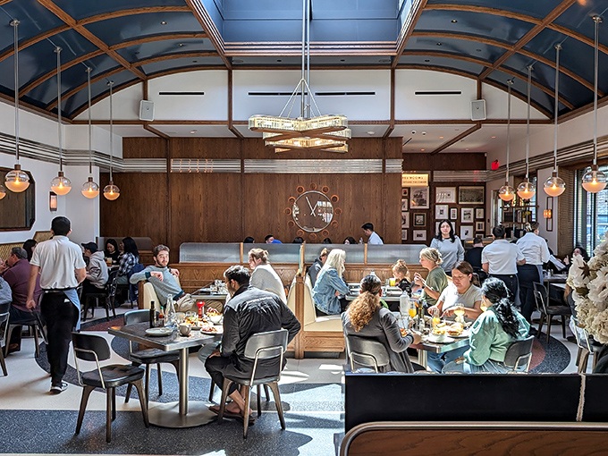 Inside, soaring ceilings and warm wood paneling create an atmosphere that's both grand and cozy&mdash;like dining in your dream kitchen, if your dreams had impeccable taste. 