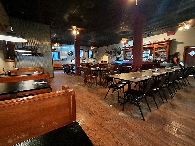 Step inside and you're greeted by wooden booths, rustic charm, and the unspoken promise that vegetarians might feel slightly outnumbered here.