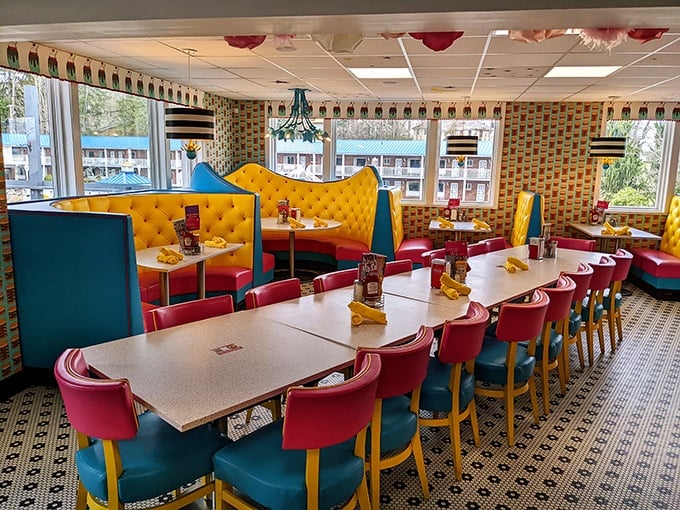 Inside, it's a retro fever dream where yellow tufted booths meet turquoise walls and cherry-red chairs. The Brady Bunch meets Willy Wonka, and somehow, it works perfectly. 