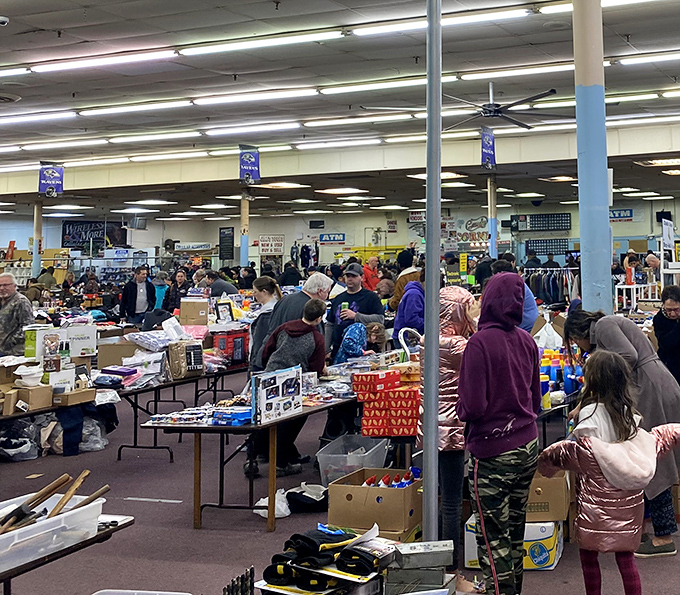 Fluorescent lights illuminate a sea of possibilities as shoppers navigate the indoor labyrinth of bargains and curiosities.