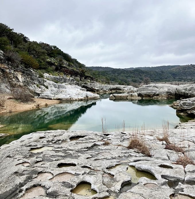 The moody side of Pedernales reveals itself under cloudy skies, transforming the falls into a contemplative landscape painting come to life.