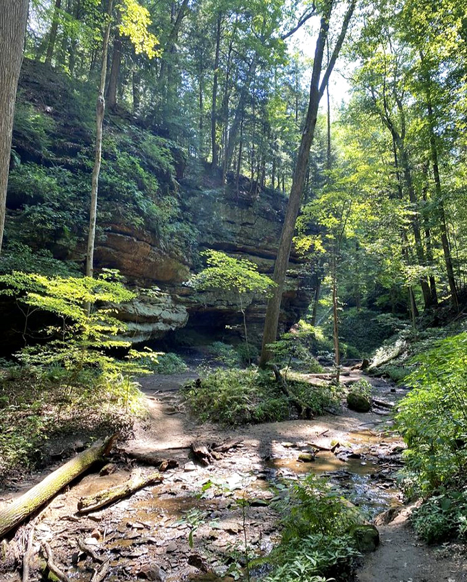 Nature's cathedral awaits as sunlight filters through ancient rock formations, creating a sanctuary where stress doesn't stand a chance.
