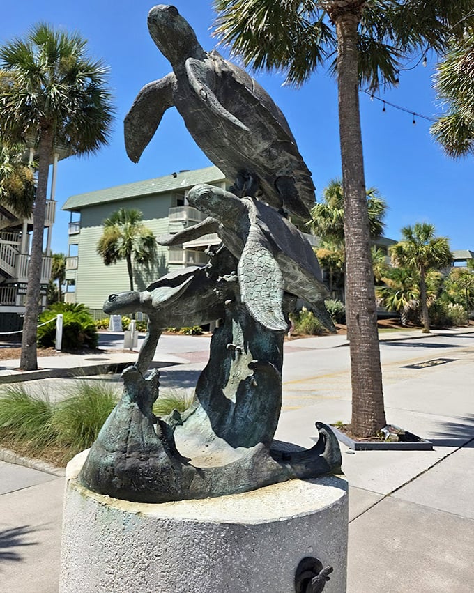 This magnificent sea turtle sculpture tells stories of ancient ocean journeys. Standing proudly among palm trees, it reminds us who the real locals are.