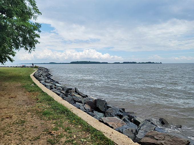 Where land meets water in a rocky embrace. This shoreline has witnessed countless sunsets, fishing tales, and first dates&mdash;each one adding to its timeless charm.
