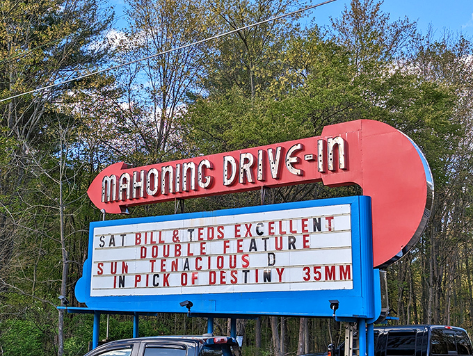 The iconic red and blue marquee announces tonight's features with the same charm it's had for generations.