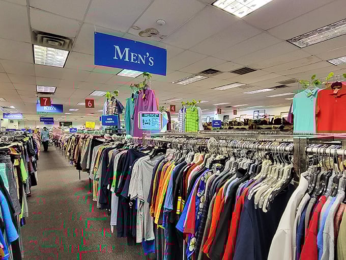 The men's section stretches toward the horizon like an endless buffet of fashion possibilities, each hanger a potential style revelation.