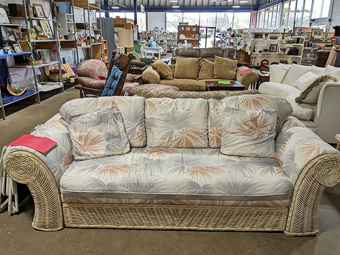 The furniture section offers a tropical getaway vibe with this wicker sofa&mdash;someone's future sunroom centerpiece awaits!