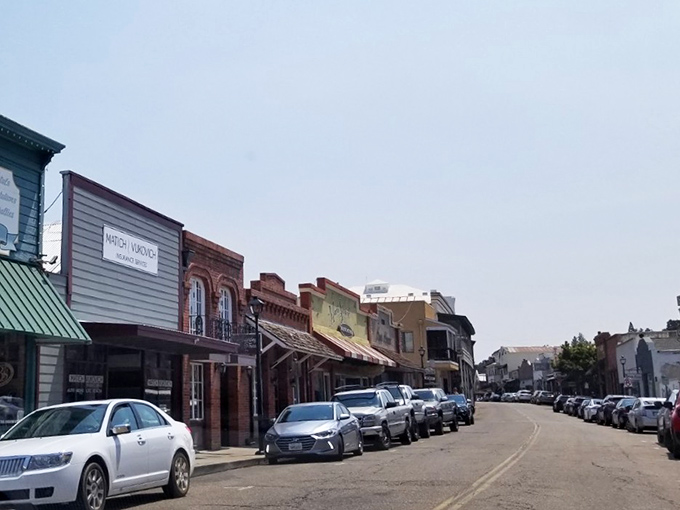 Colorful storefronts line Jackson's historic thoroughfare, where parking is plentiful and window shopping costs exactly zero dollars.