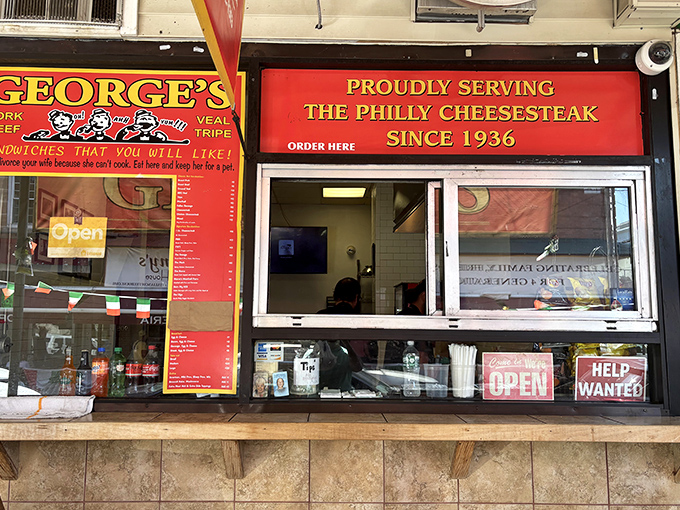 ORDER HERE - three syllables that promise sandwich nirvana. The simplicity of George's window service is part of its timeless charm.