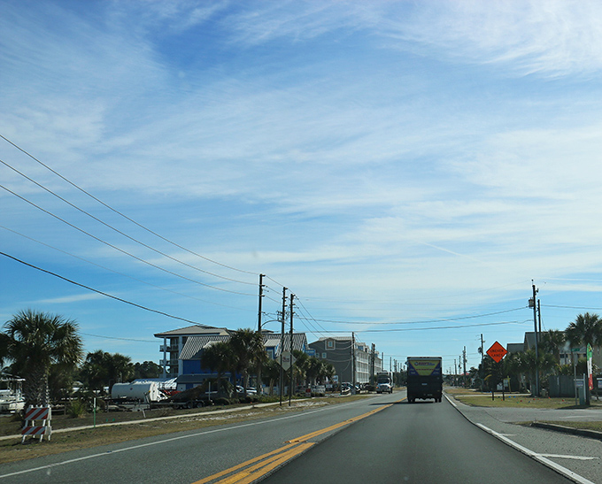 Cruising down Highway 98, palm trees standing guard. This unassuming main drag is your gateway to coastal bliss.