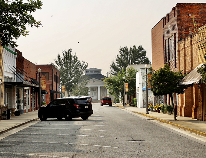 Downtown Vidalia's historic streetscape invites leisurely exploration, with classic brick buildings framing a view that Norman Rockwell would have rushed to paint.