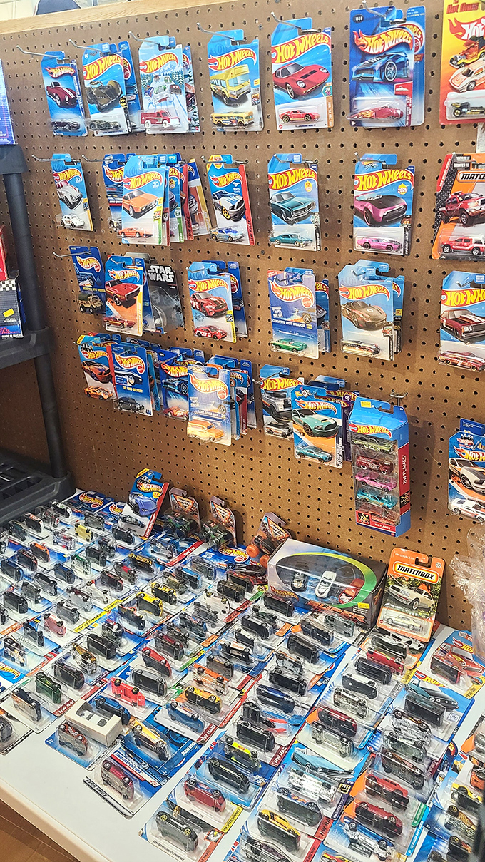 Hot Wheels heaven! For collectors, this pegboard paradise offers tiny time machines that transport you straight back to childhood racing adventures.