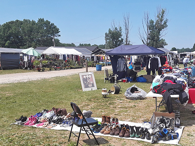 Shoes scattered on blankets like a suburban yard sale, except here the deals actually make sense.