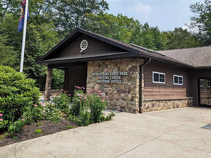The rustic welcome wagon! This charming visitor center, with its stone facade and blooming gardens, serves as your gateway to adventure. 