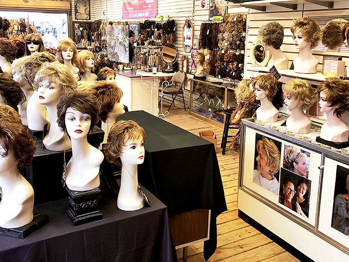A silent audience awaits their next adventure. This wig vendor's display might be the most attentive crowd you'll ever address.