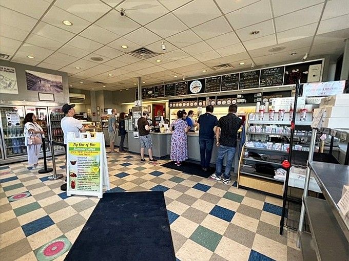 Step inside where checkered floors and genuine smiles create the perfect backdrop for morning magic.
