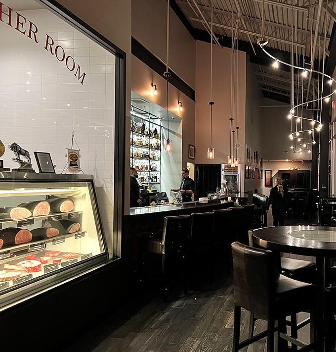 Where "The Butcher Room" displays premium cuts like culinary crown jewels behind pristine glass - beef royalty at its finest.