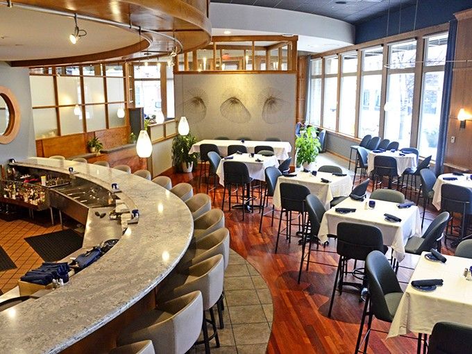 This curved bar isn't just seating&mdash;it's your front-row ticket to watching culinary artistry unfold before your eyes.